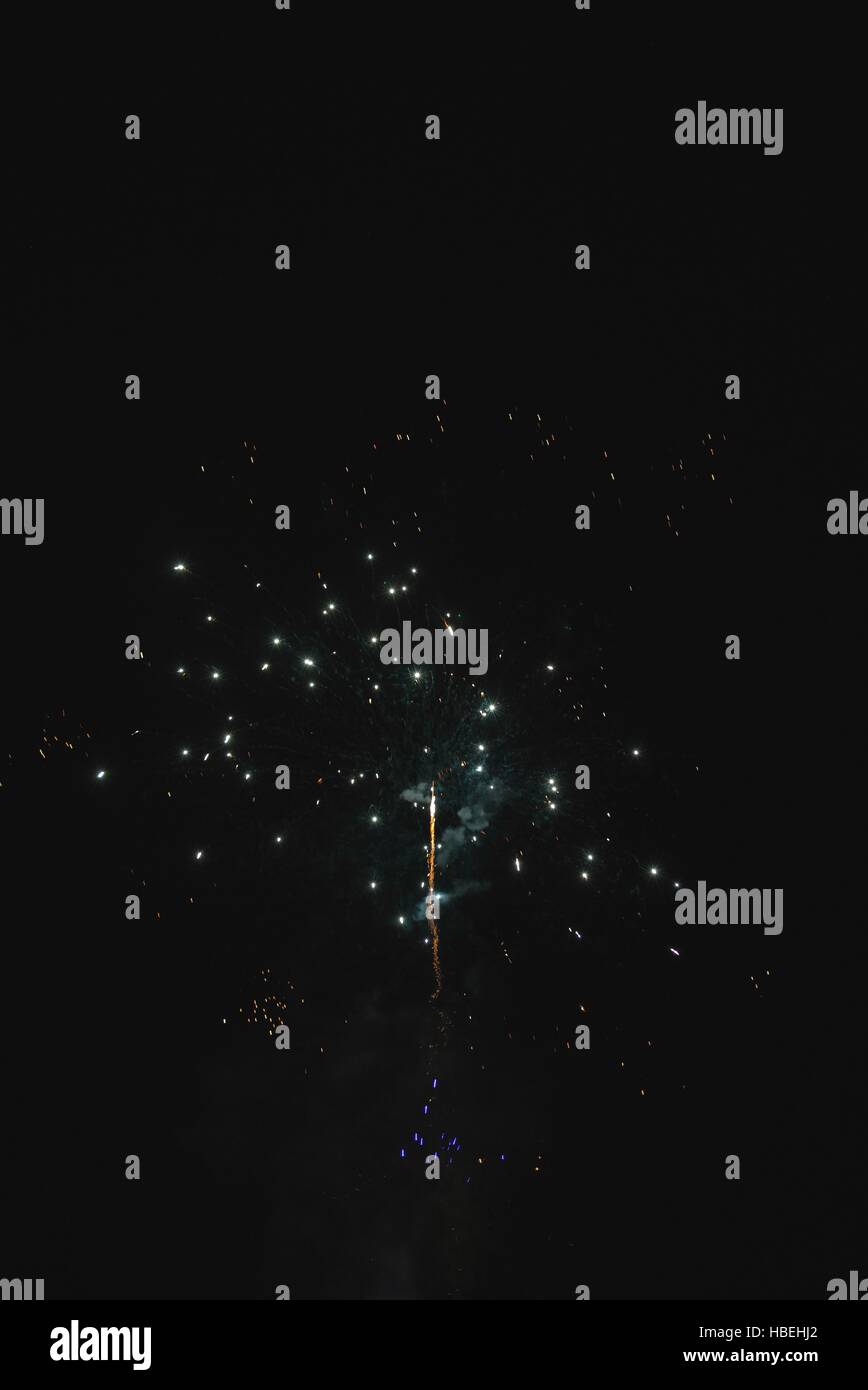 Shiny natural fireworks on dark black sky background with a little ...