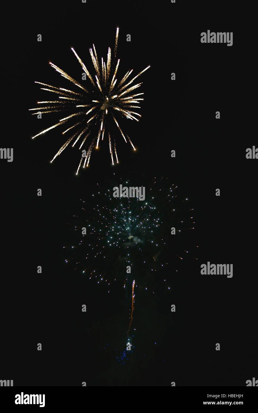 Shiny natural fireworks on dark black sky background with a little ...