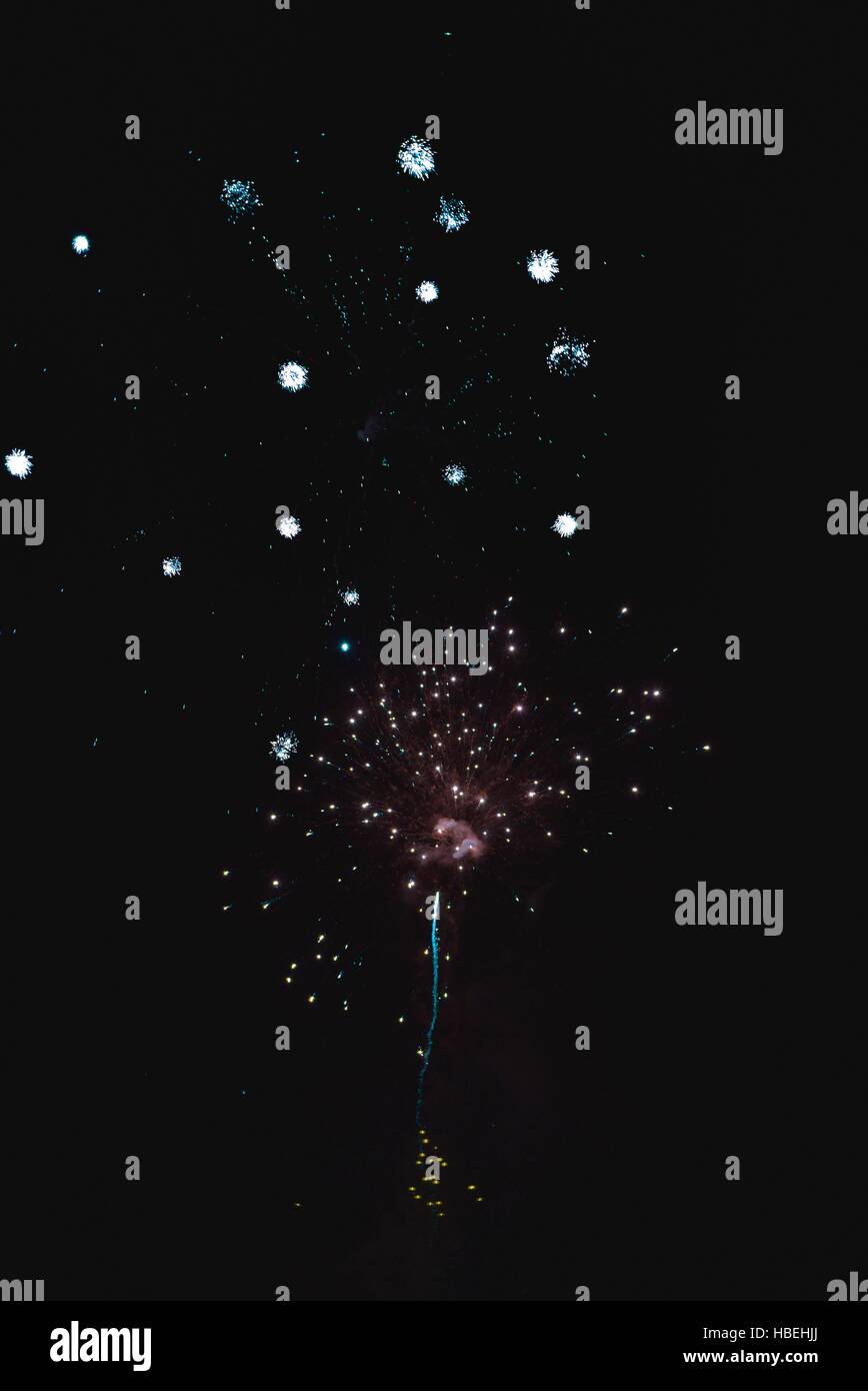 Shiny natural fireworks on dark black sky background with a little ...