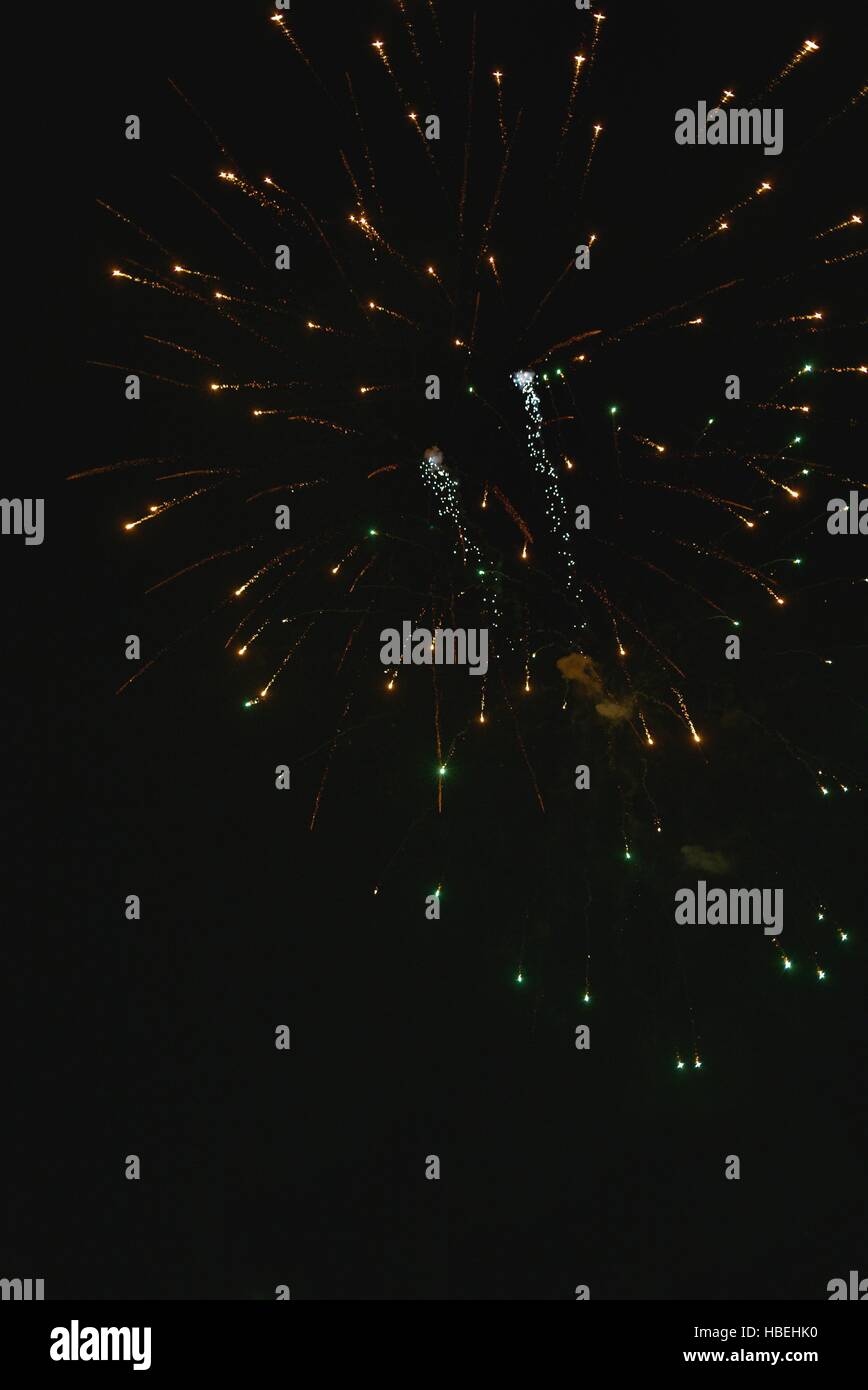 Shiny natural fireworks on dark black sky background with a little ...