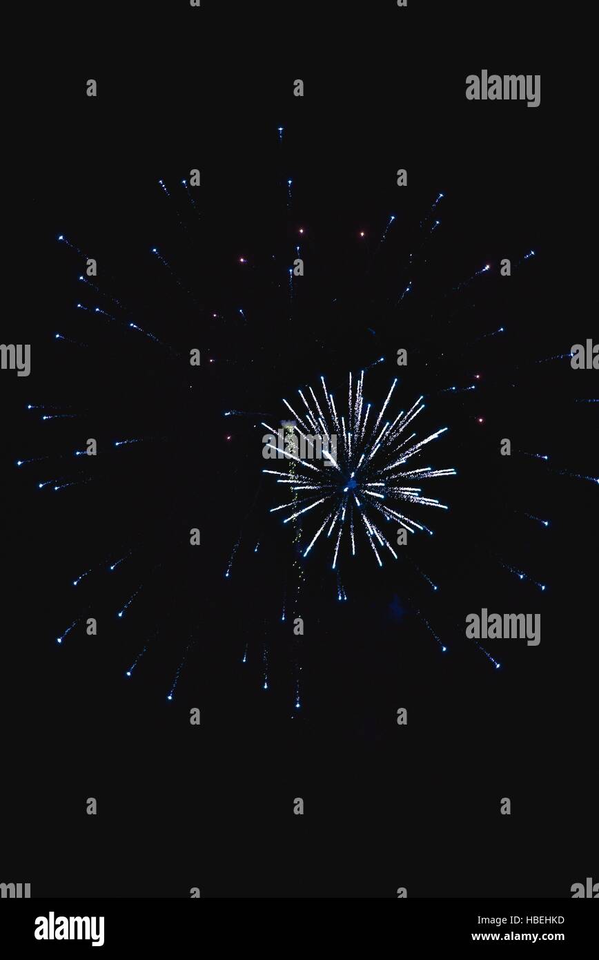 Shiny natural fireworks on dark black sky background with a little ...