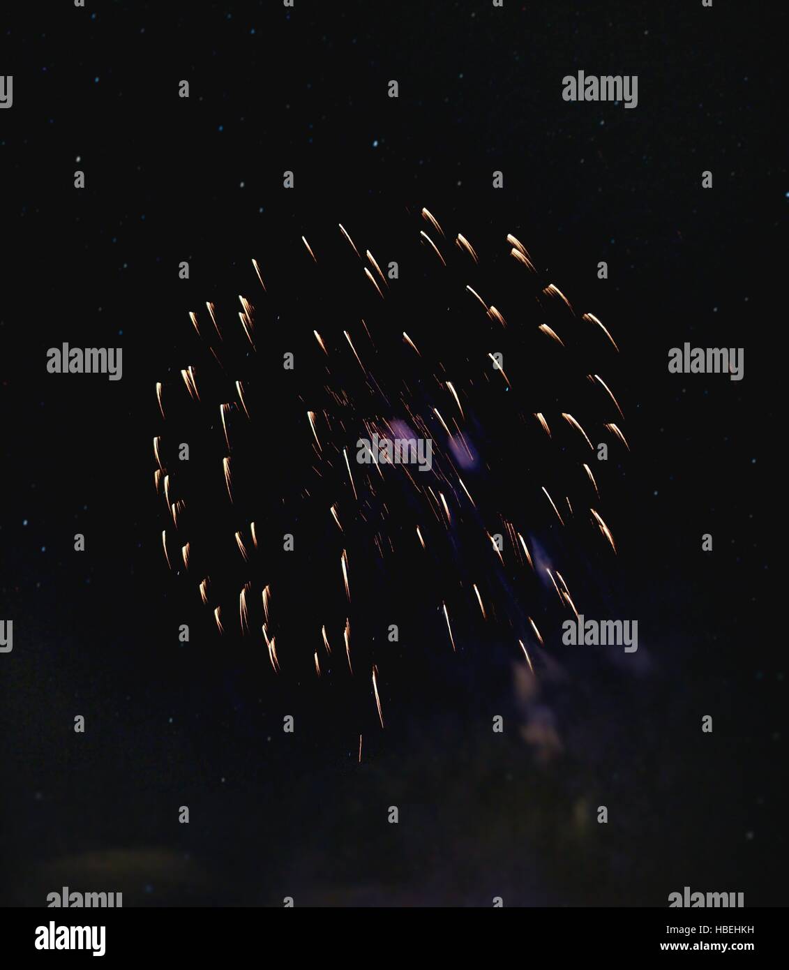 Shiny natural fireworks on dark black sky background with a little ...