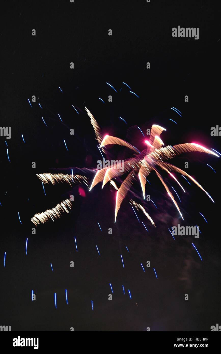 Shiny natural fireworks on dark black sky background with a little ...