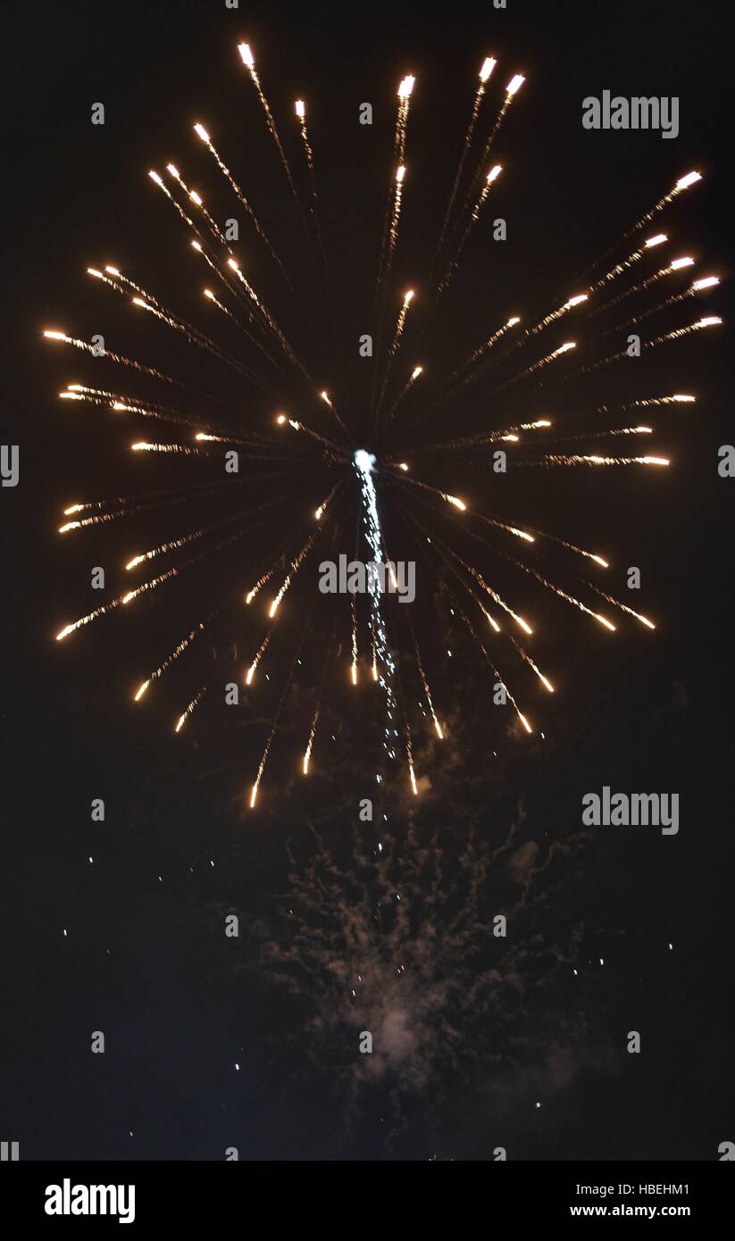 Shiny natural fireworks on dark black sky background with a little ...
