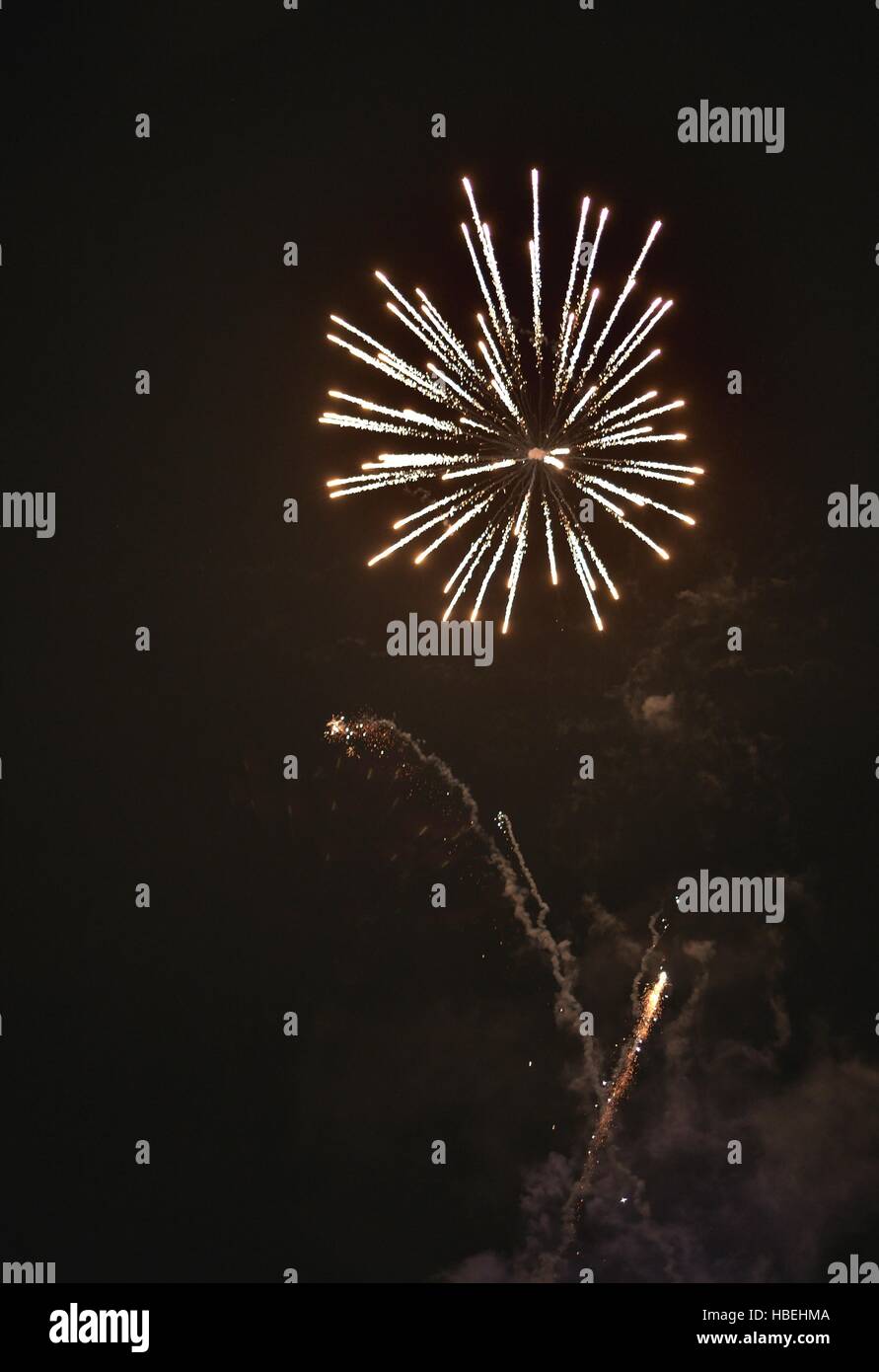 Shiny natural fireworks on dark black sky background with a little ...