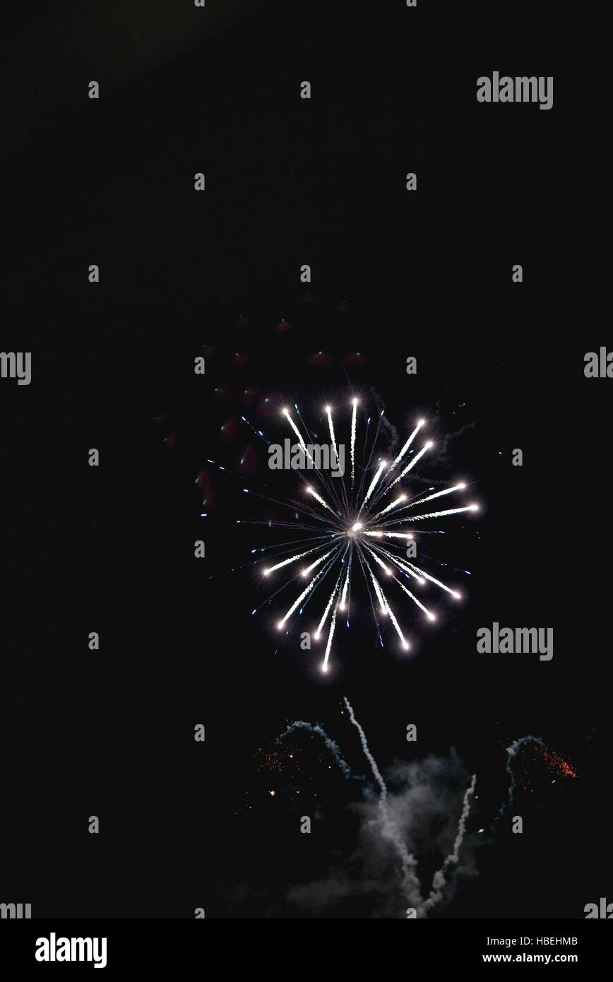 Shiny natural fireworks on dark black sky background with a little ...