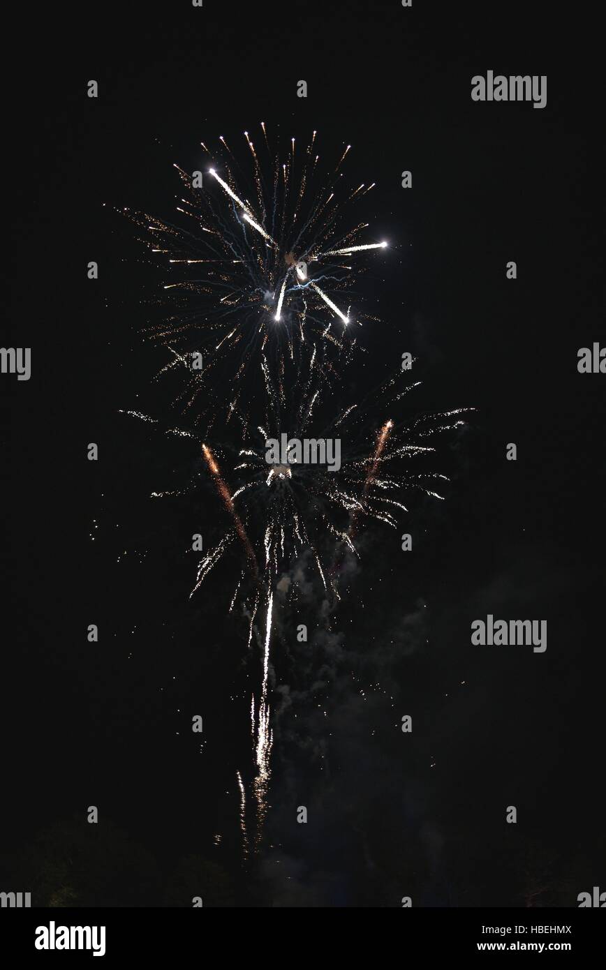 Shiny natural fireworks on dark black sky background with a little ...