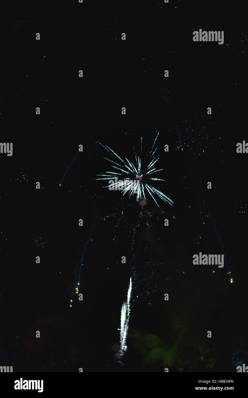 Shiny natural fireworks on dark black sky background with a little ...