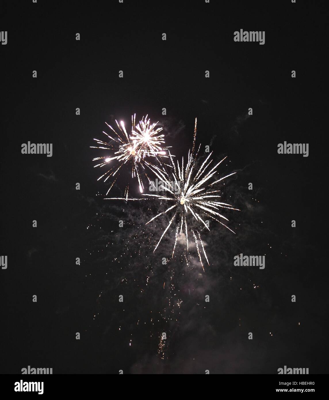 Shiny natural fireworks on dark black sky background with a little ...