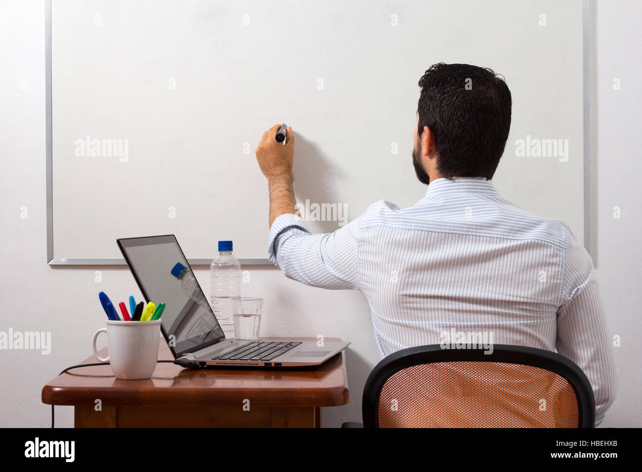 Man writing in white board. Place your content Stock Photo - Alamy