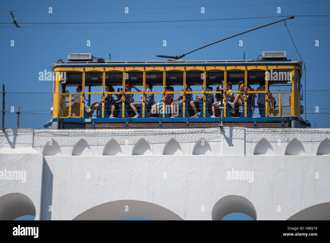 Tourists ride the Santa Teresa bonde historic tram line across the ...