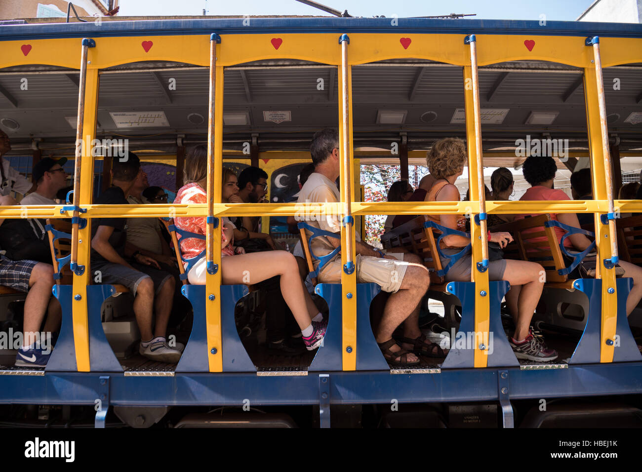 Tourists ride the Santa Teresa bonde historic tram line through the ...