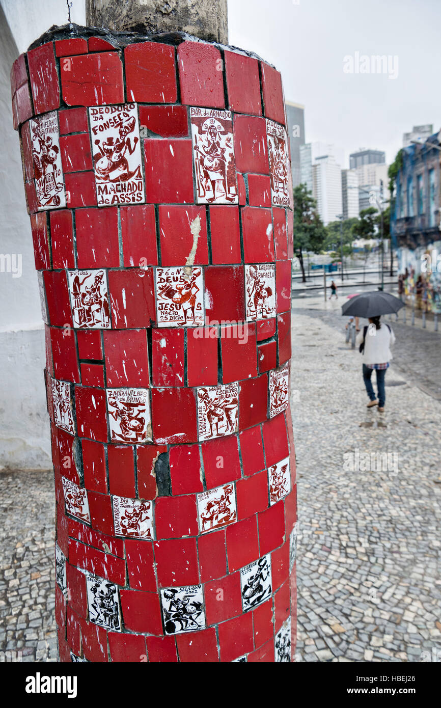 A tile art work around a telephone pole in the Lapa neighborhood of Rio ...