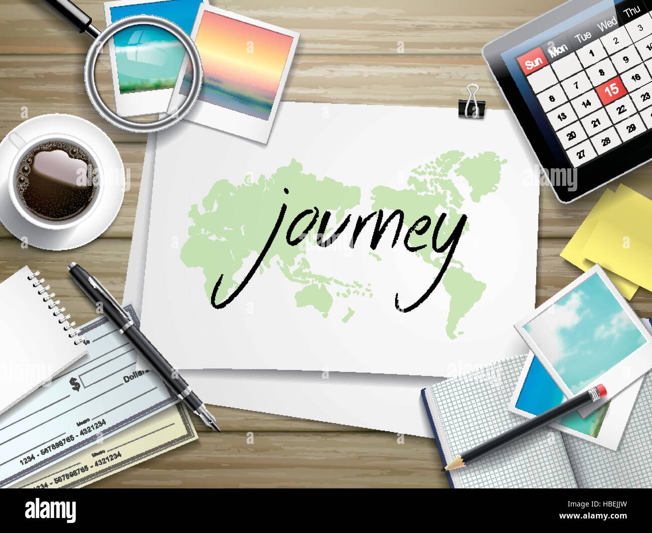 top view of travel items on wooden table with journey word written on ...