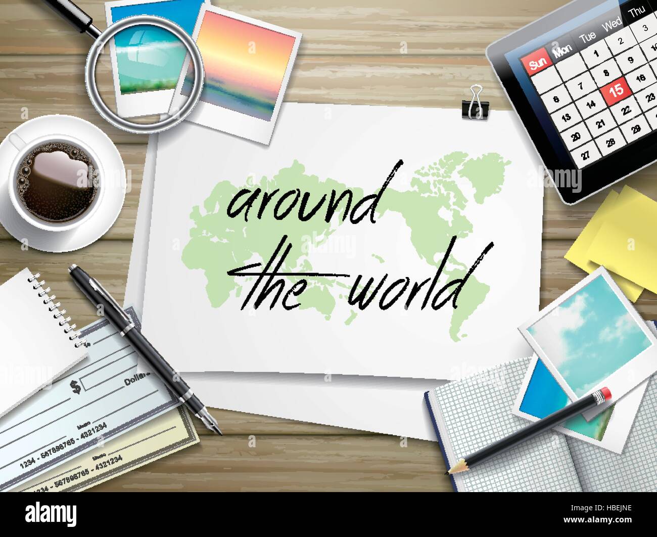 top view of travel items on wooden table with around the world written ...