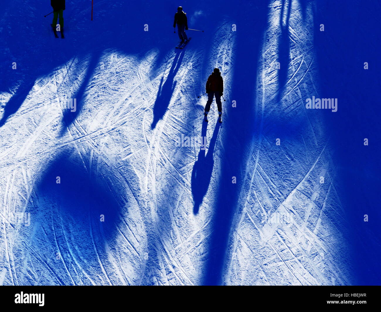Skiers shadows on snow Stock Photo - Alamy