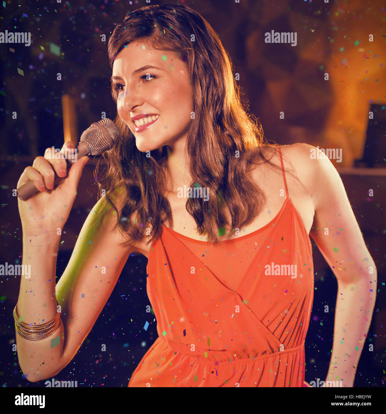 Woman singing song in microphone hi-res stock photography and images ...