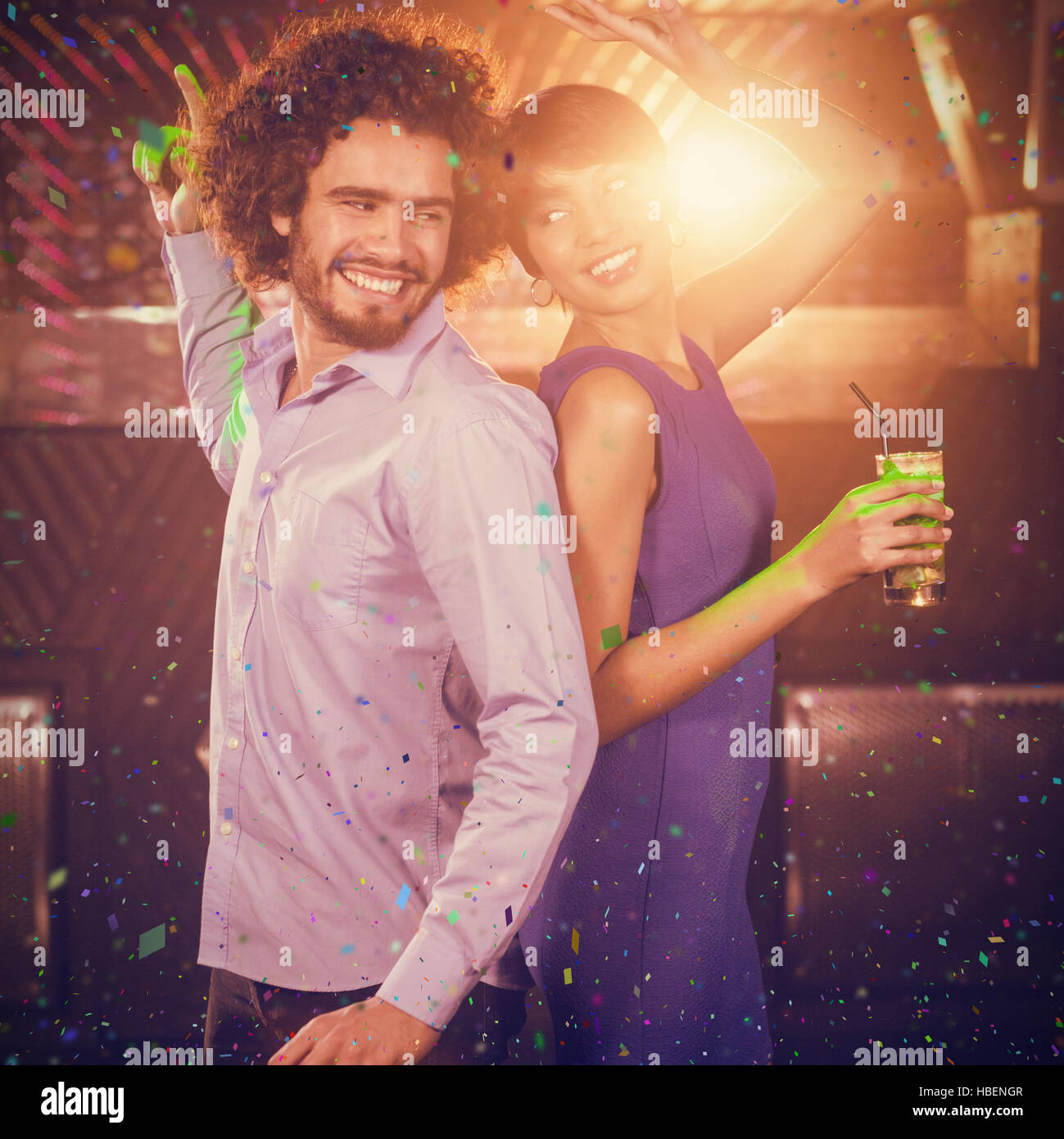 Composite image of cute couple dancing together on dance floor while ...