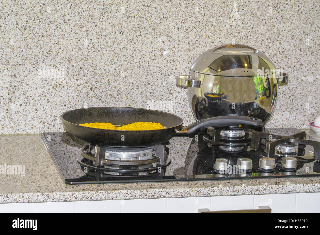 Pot and pan on a gas cooker Stock Photo - Alamy