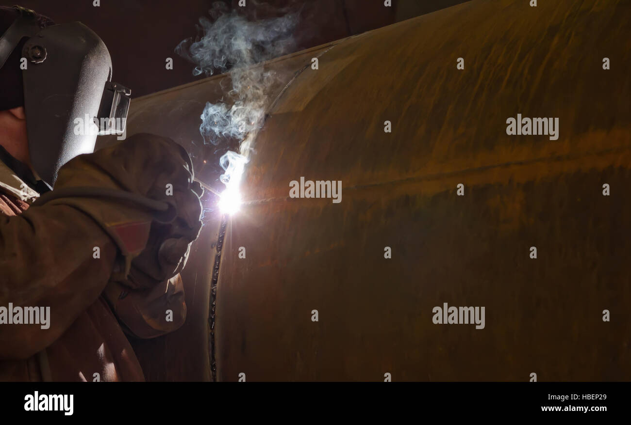 welder performs welding large diameter pipe Stock Photo - Alamy
