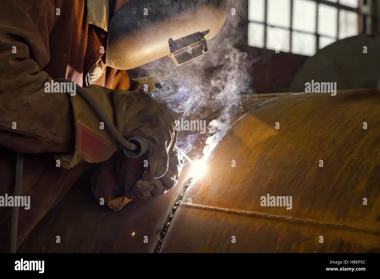 welder performs welding large diameter pipe Stock Photo - Alamy