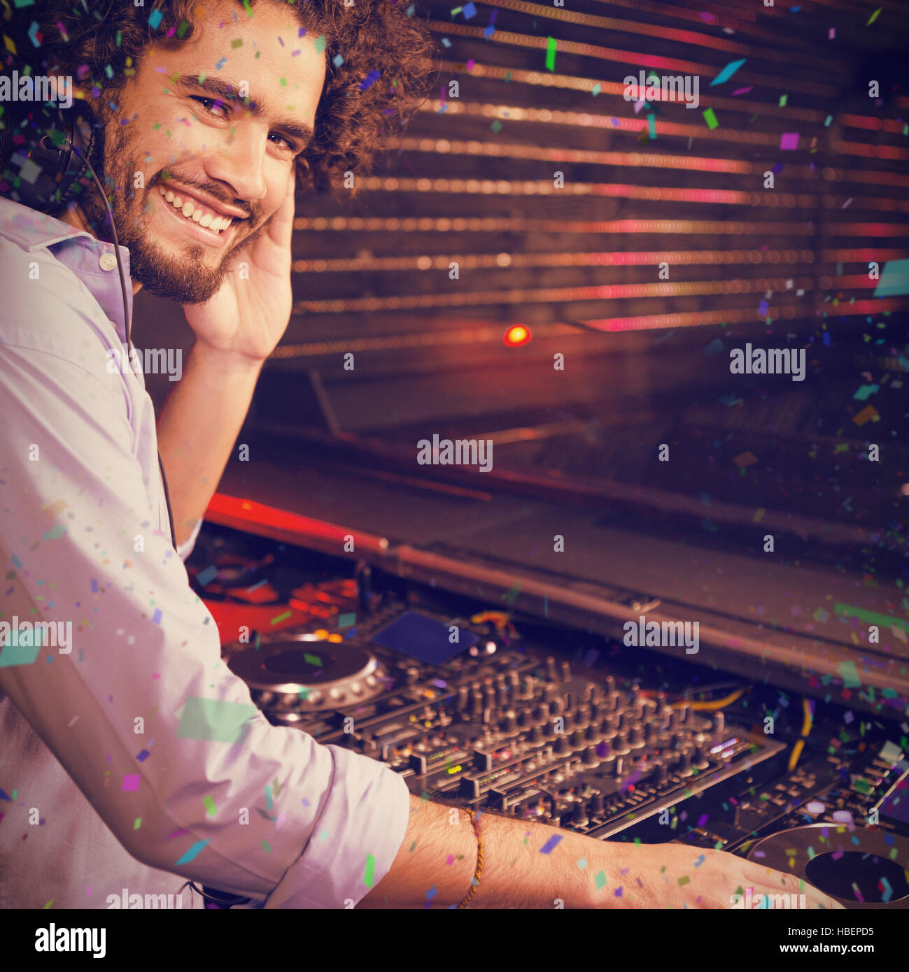 Composite image of male dj playing music Stock Photo - Alamy