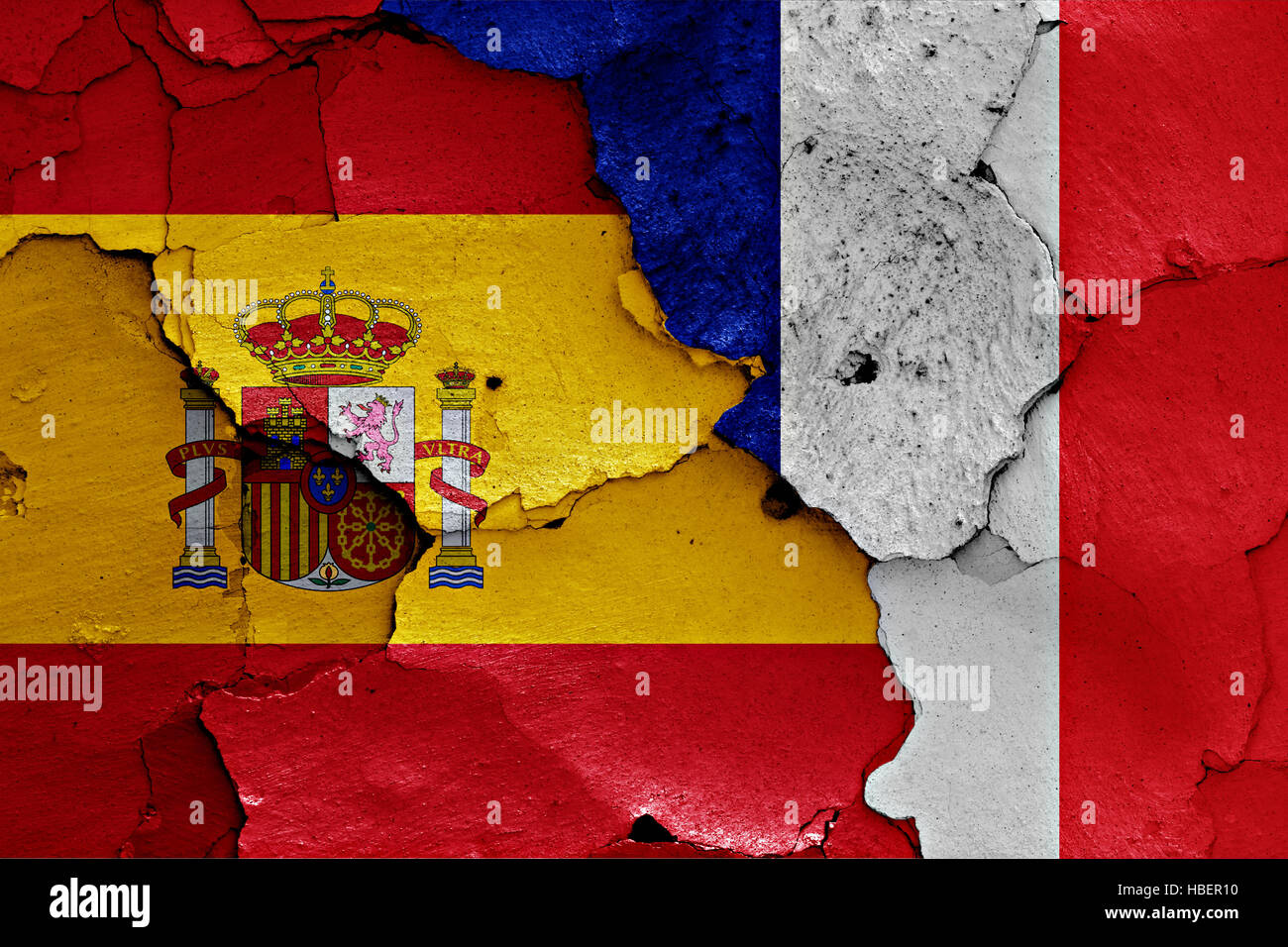 flags of Spain and France painted on cracked wall Stock Photo - Alamy