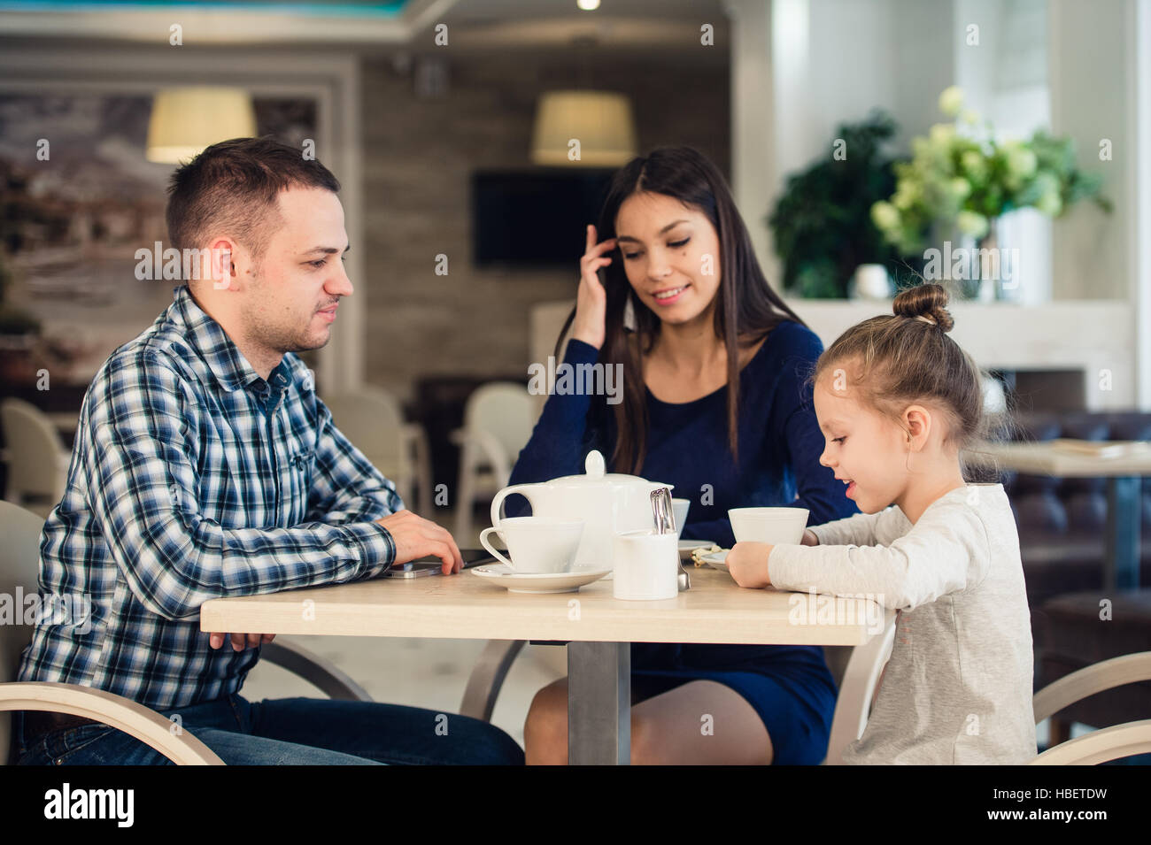 Family enjoying tea in cafe hi-res stock photography and images - Alamy