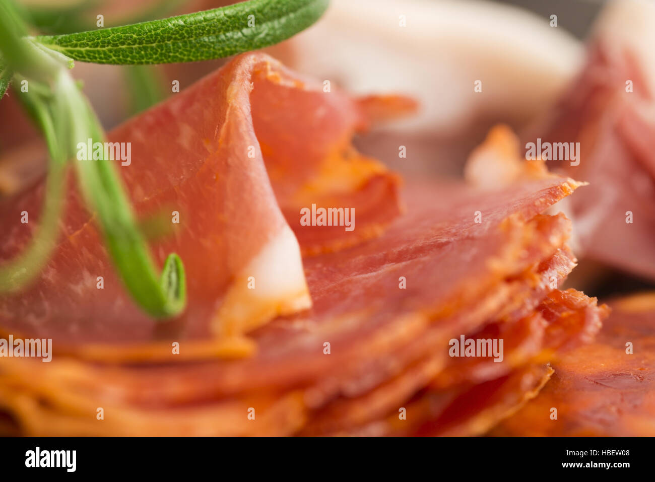 a pile of different spanish embutido, jamon, chorizo and lomo embuchado ...