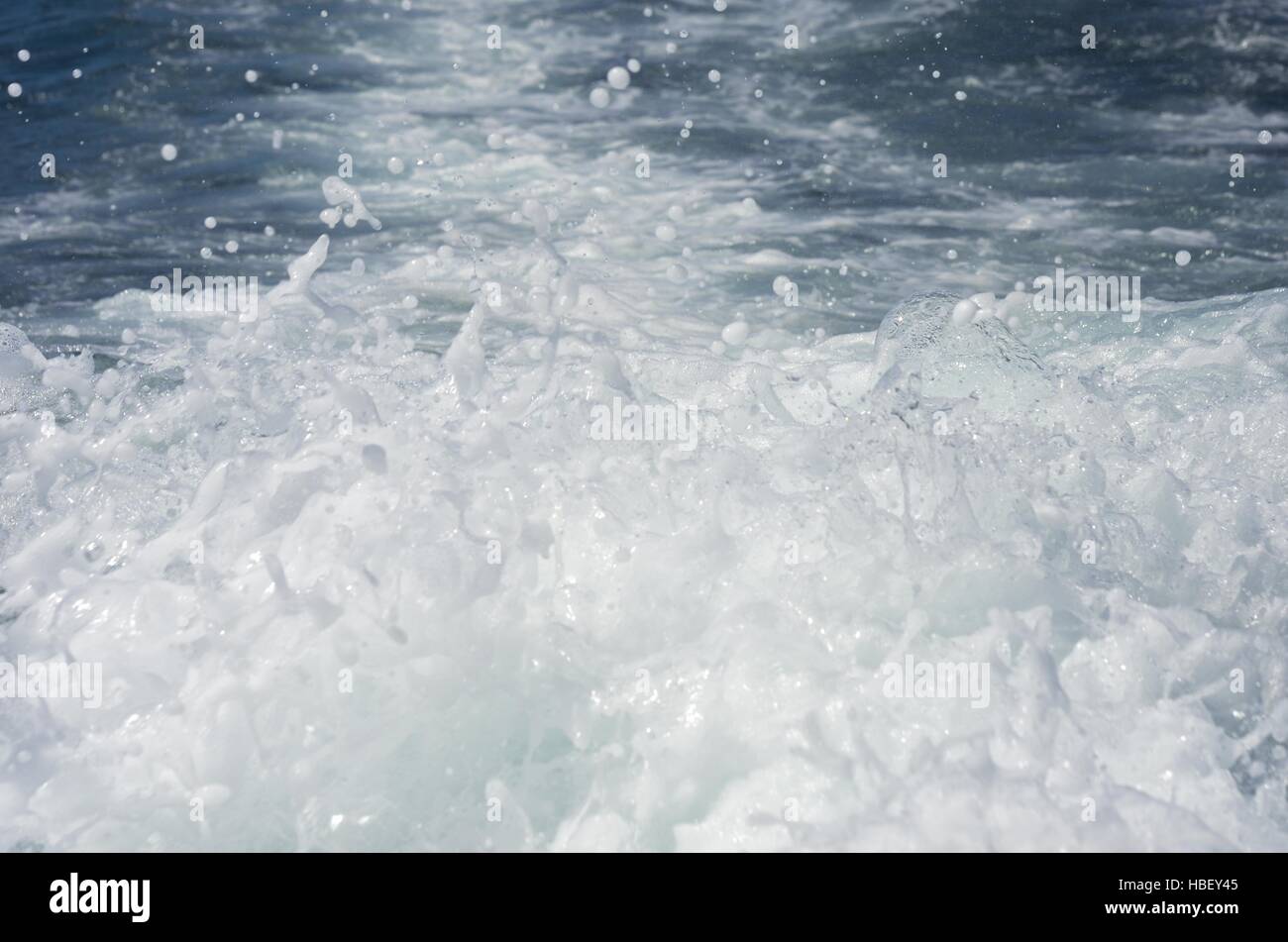 Foaming water behind boat Stock Photo - Alamy