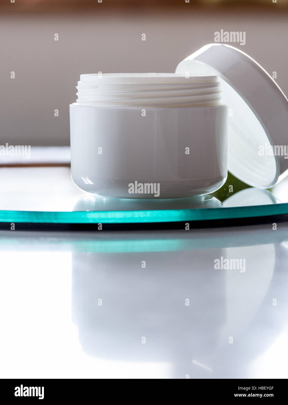 Opened jar of cream Stock Photo - Alamy