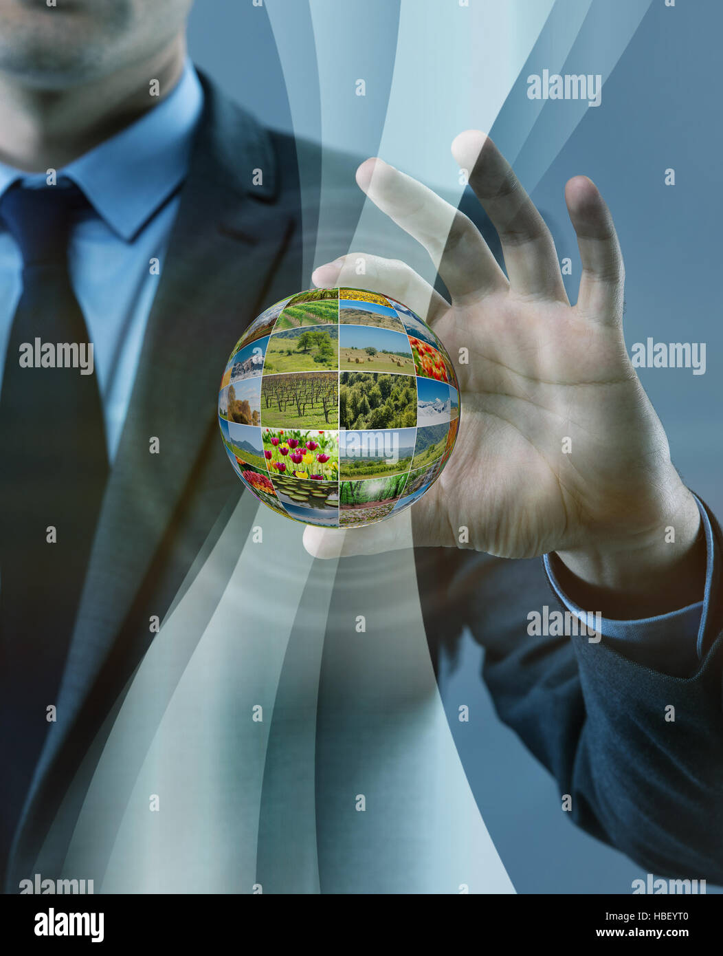 Man holding earth with nature photos Stock Photo - Alamy
