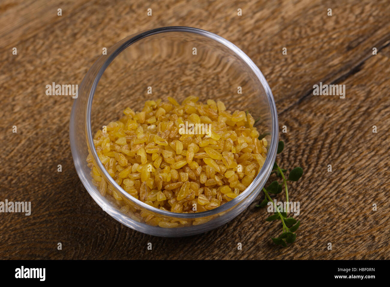 Raw bulgur heap in the bowl ready for cooking Stock Photo - Alamy
