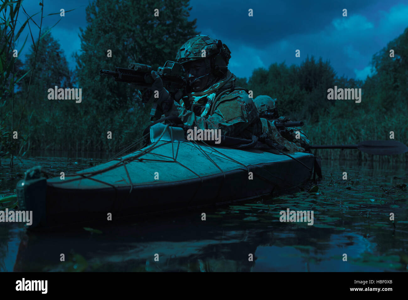 Spec ops in the military kayak Stock Photo - Alamy