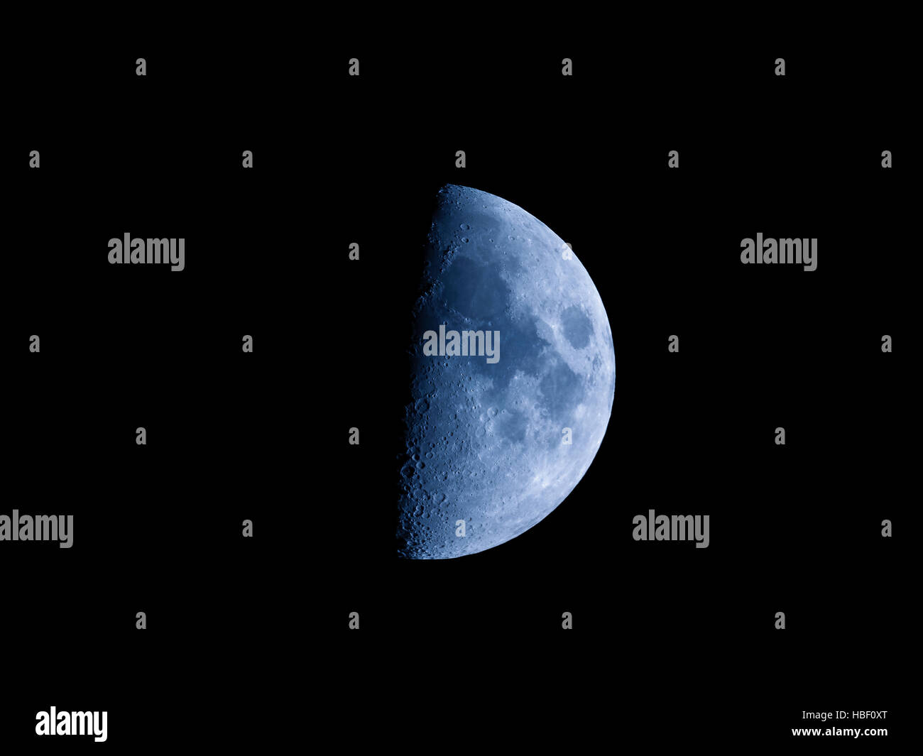 First quarter moon Stock Photo - Alamy
