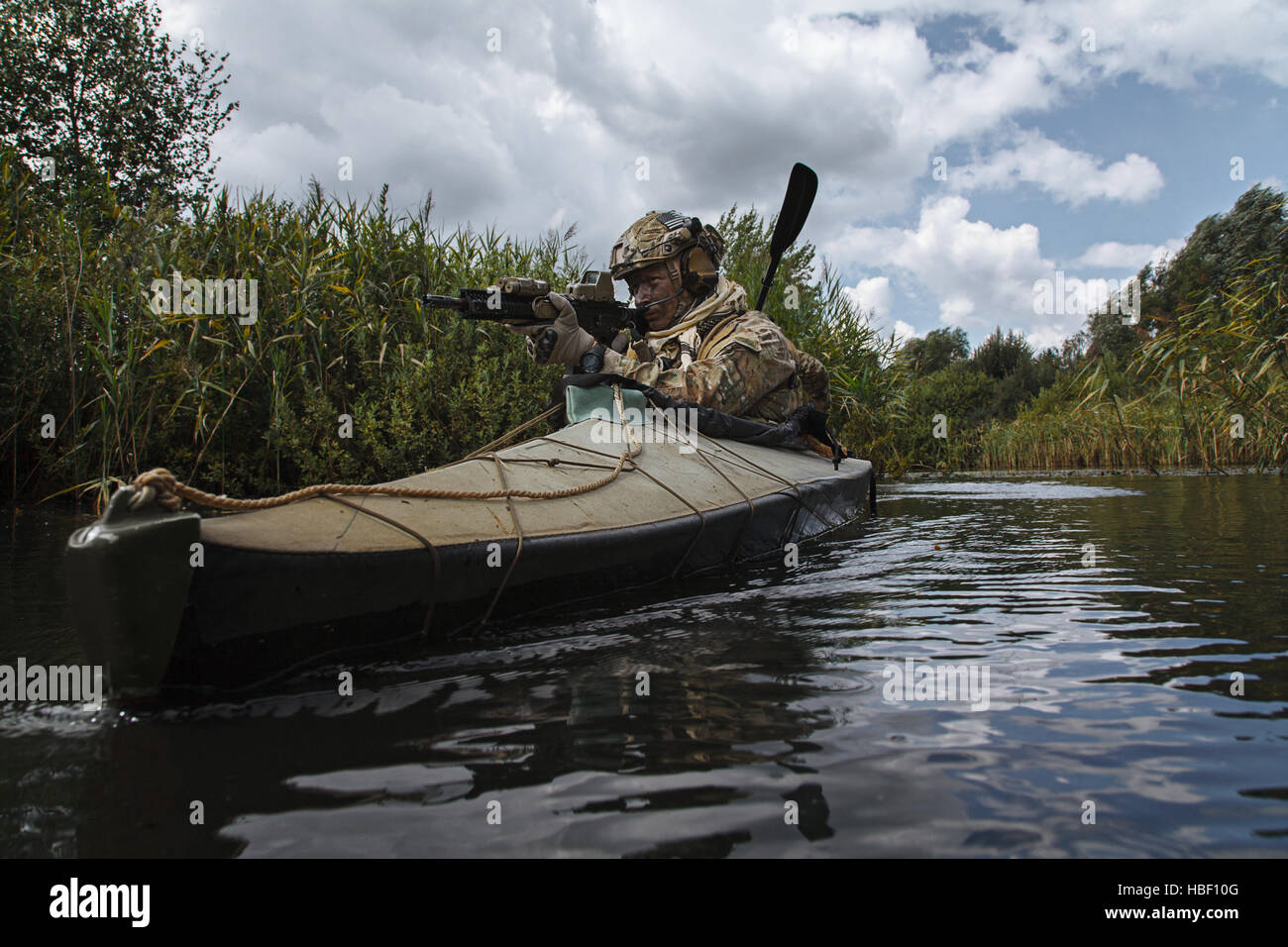 Spec ops in the military kayak Stock Photo - Alamy