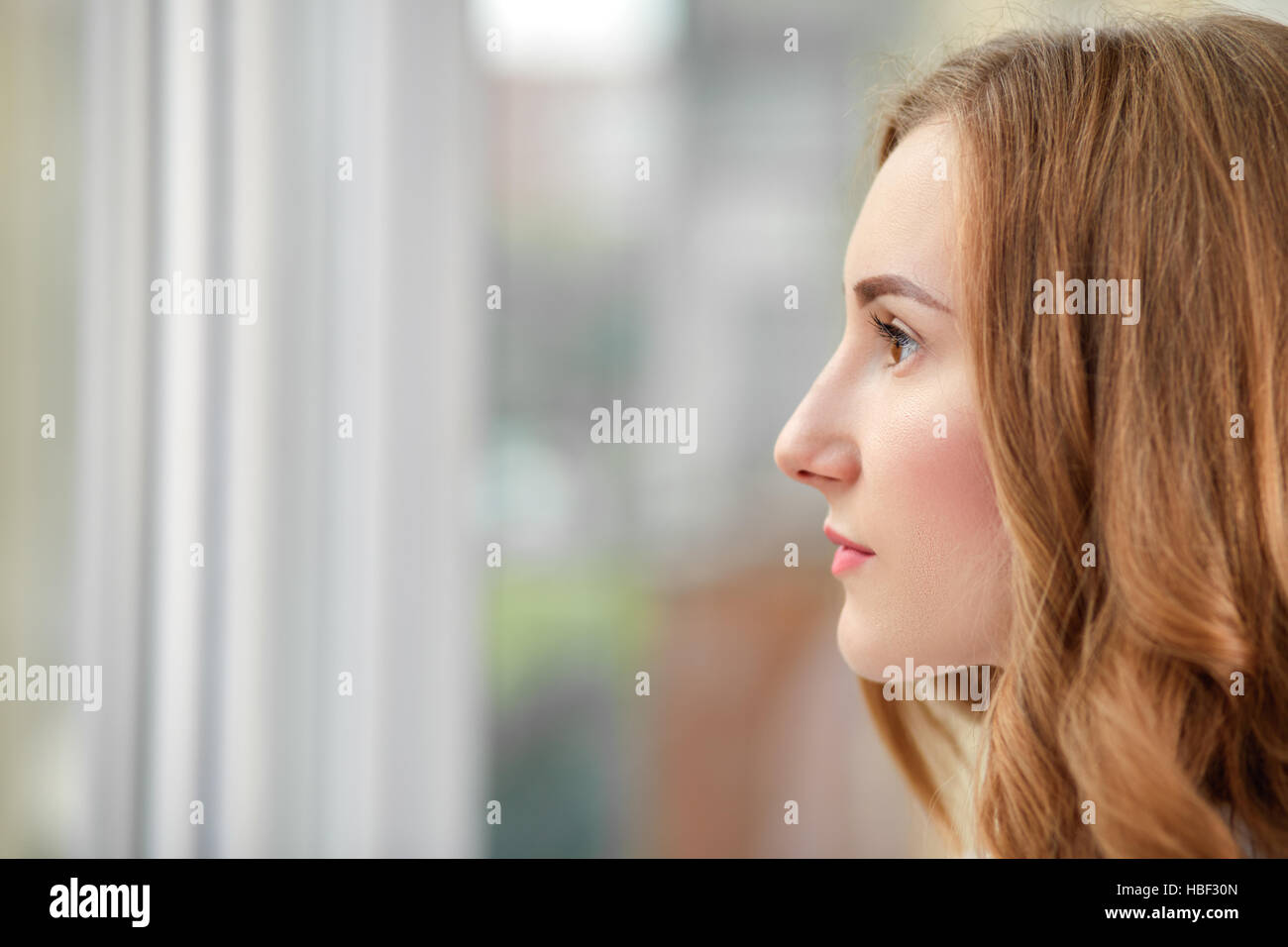 Side profile woman sad hi-res stock photography and images - Alamy