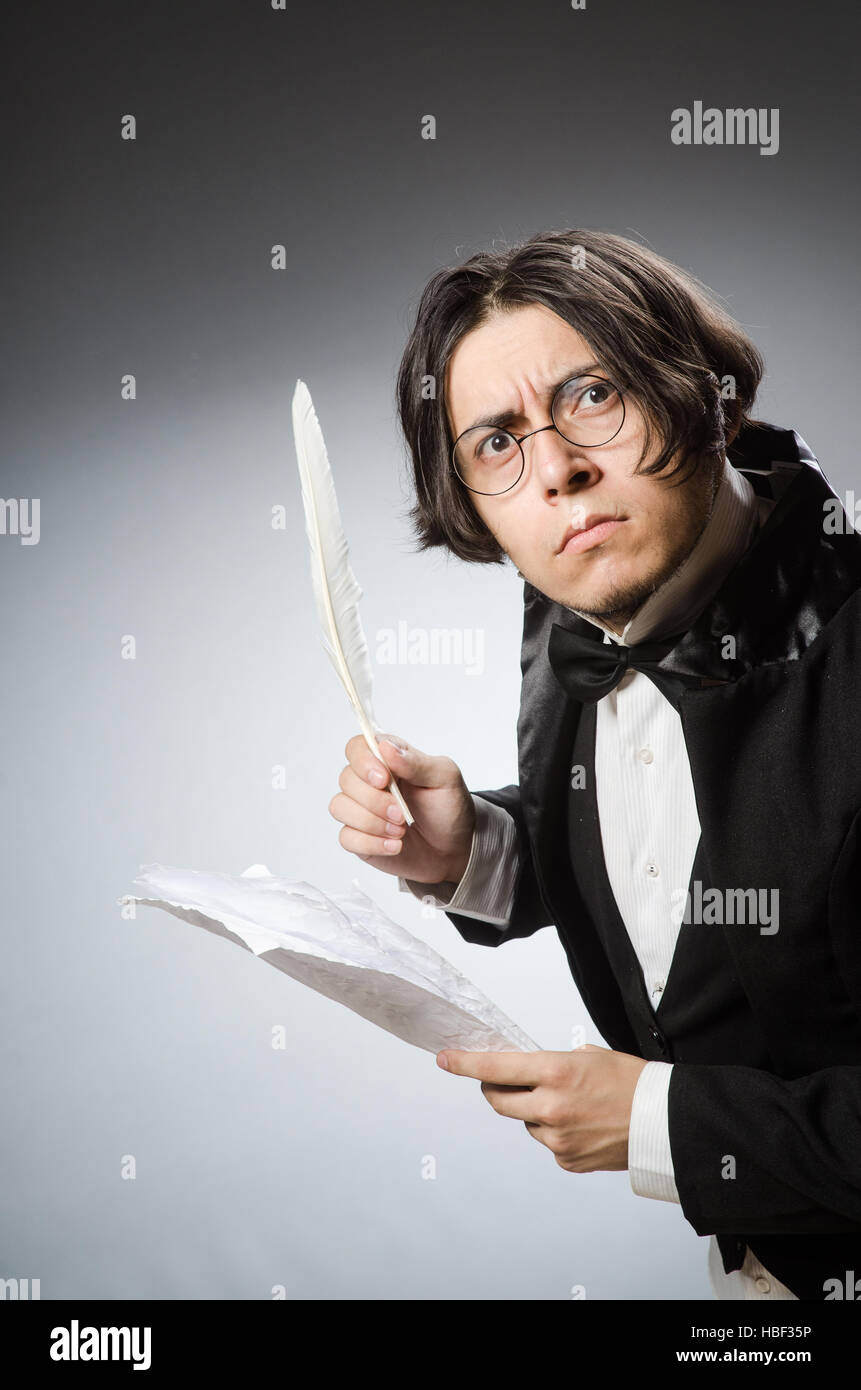 Funny writer with quill in vintage concept Stock Photo - Alamy
