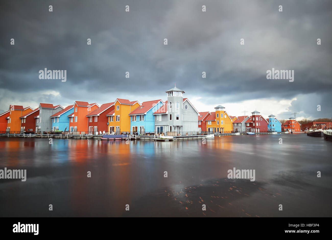 colorful buildings on water during storm Stock Photo - Alamy