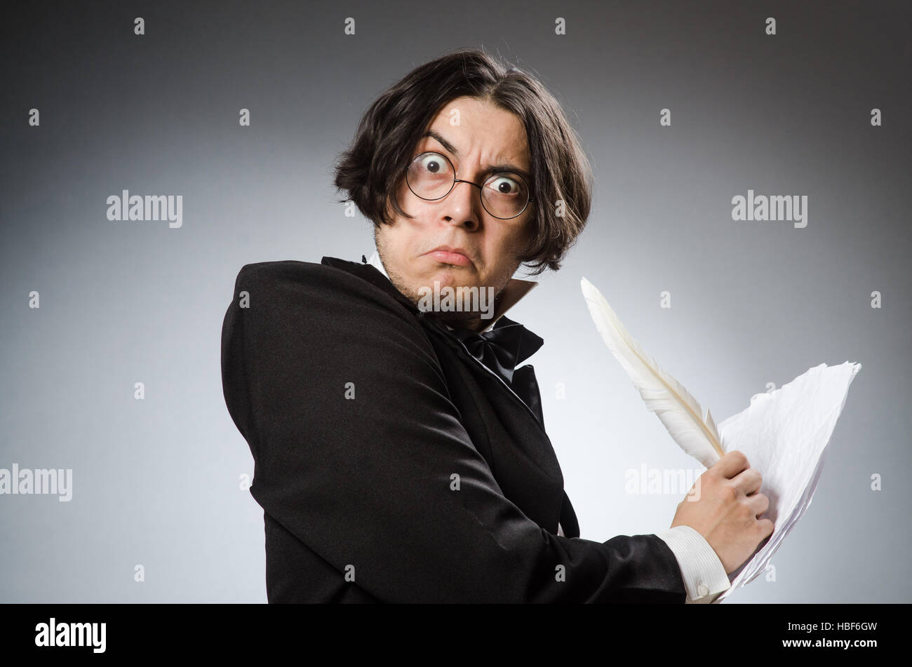 Funny writer with quill in vintage concept Stock Photo - Alamy