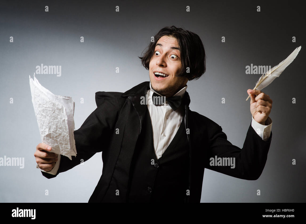 Funny writer with quill in vintage concept Stock Photo - Alamy