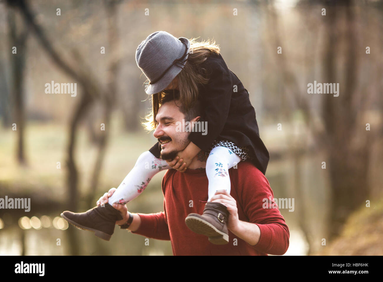 father carrying his daughter Stock Photo - Alamy