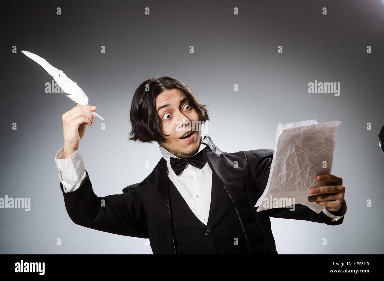 Funny writer with quill in vintage concept Stock Photo - Alamy