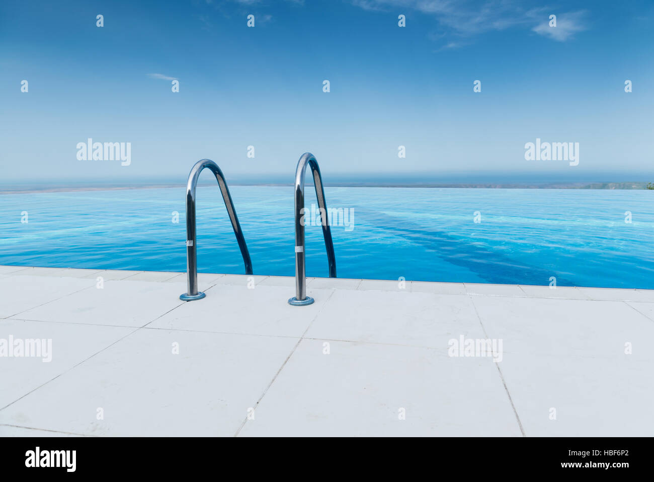 Infinity pool on the bright summer day Stock Photo - Alamy