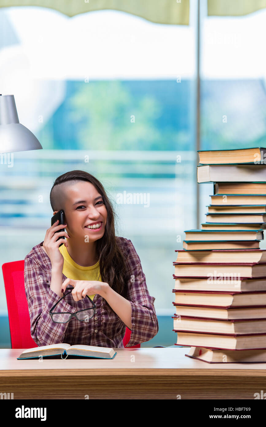 Young female student talking on mobile phone Stock Photo - Alamy