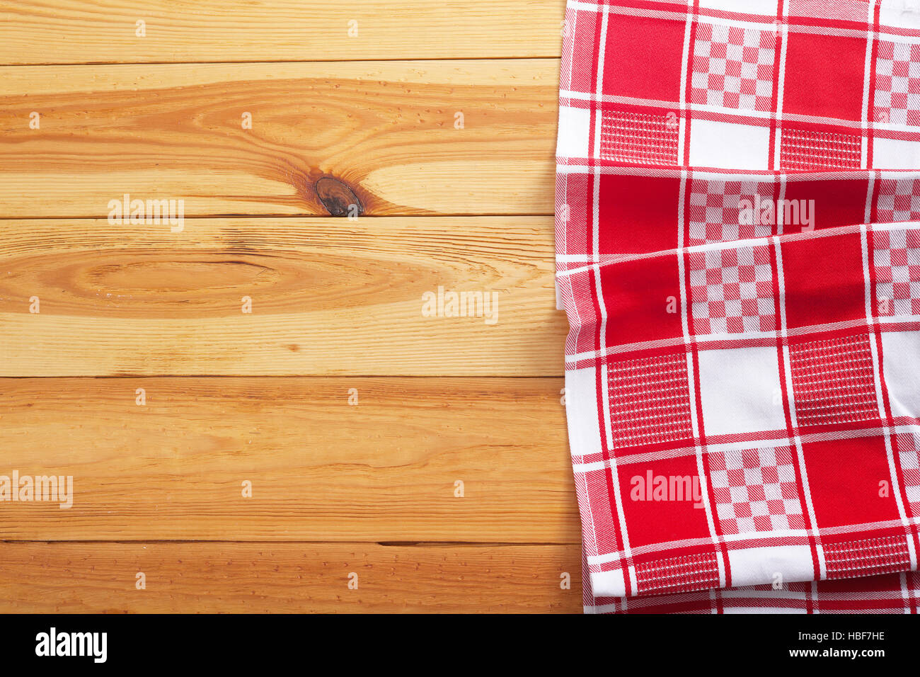 Red tablecloth over wooden table. Mockup top view Stock Photo - Alamy