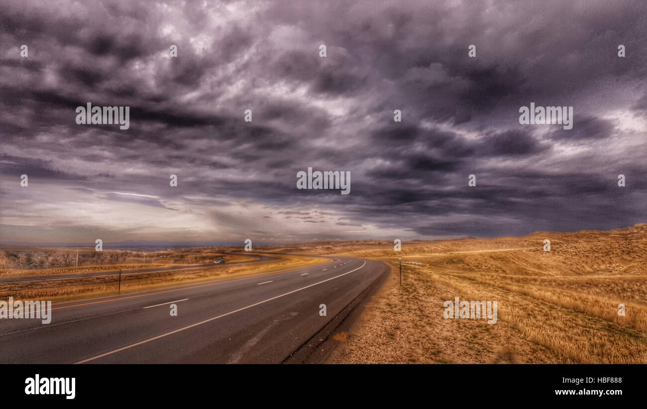Dark storm clouds over a country highway Stock Photo - Alamy