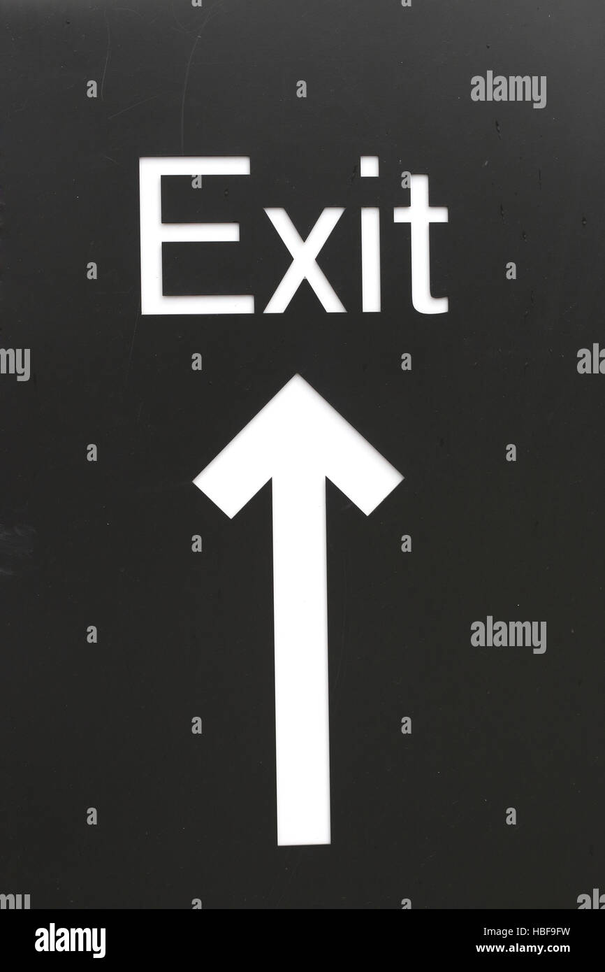 Exit sign on black background Stock Photo - Alamy