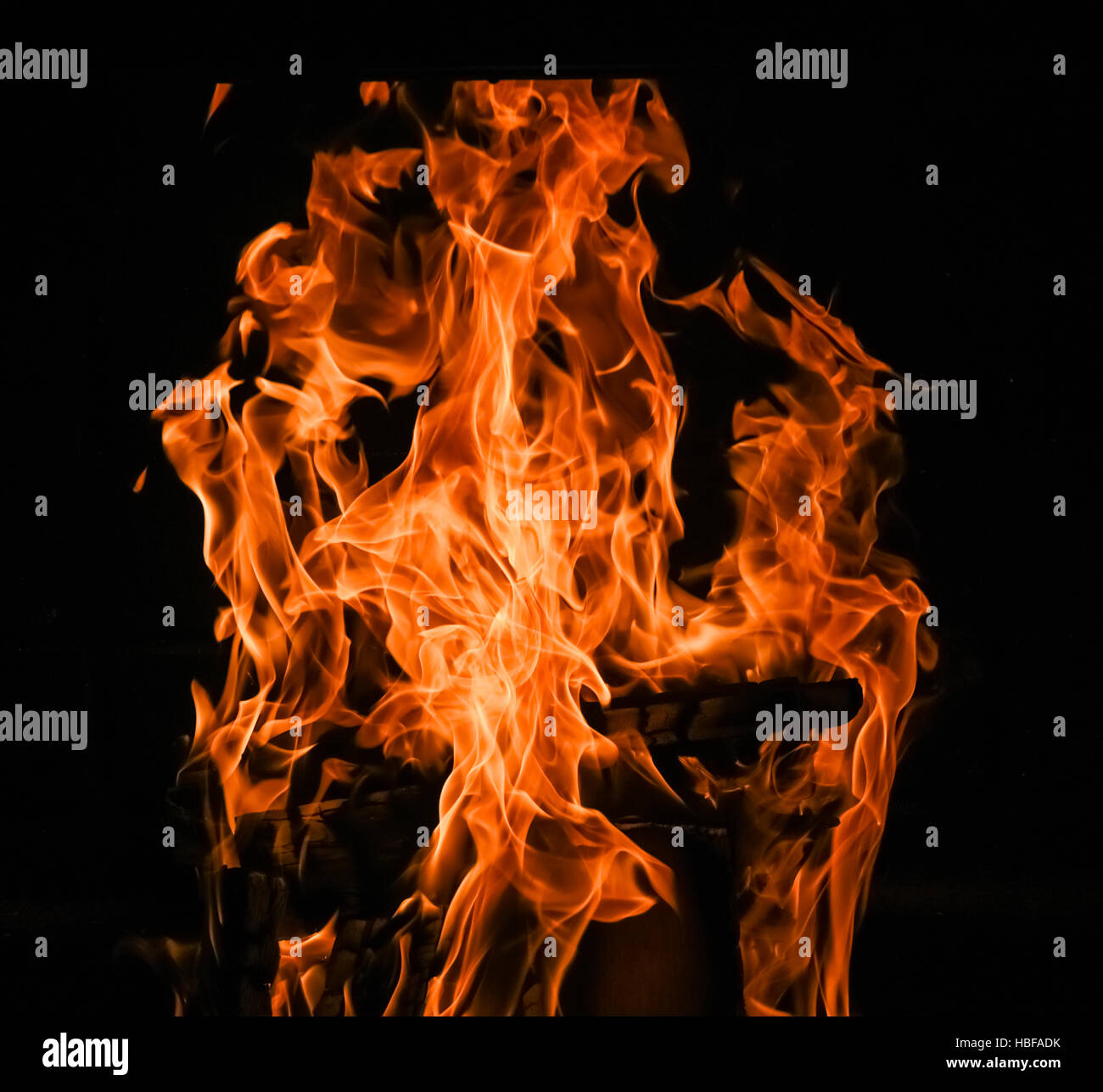 raging flames red fire black background Stock Photo - Alamy