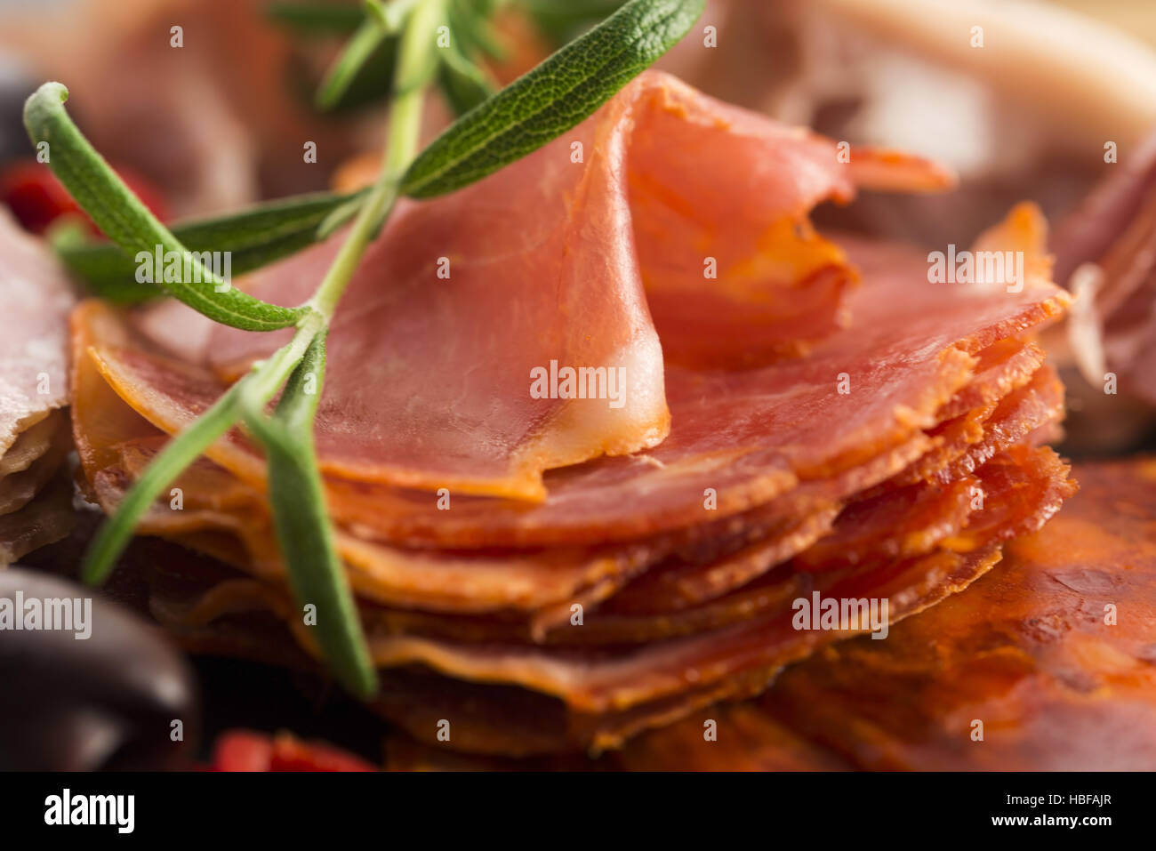 a pile of different spanish embutido, jamon, chorizo and lomo embuchado ...